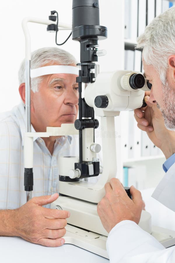 Optometrist Doing Sight Testing for Senior Patient Stock Image - Image ...