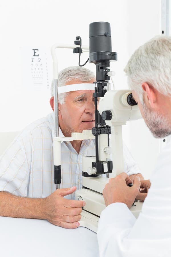 Optometrist Doing Sight Testing for Senior Patient Stock Photo - Image ...