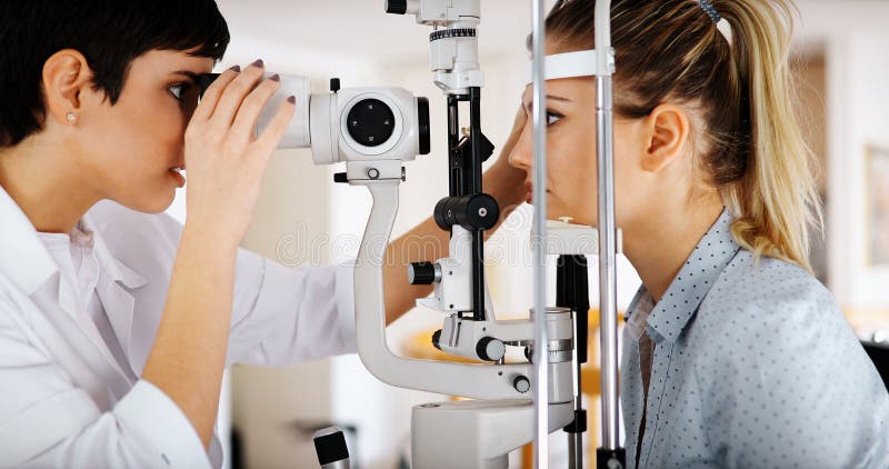 Optometrist Examining Patient in Modern Ophthalmology Clinic Stock ... Optometrist Examining Patient in Modern Ophthalmology Clinic Stock ...