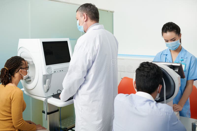 Doctors Checking Eyesight of Patients Stock Photo - Image of caucasian ...