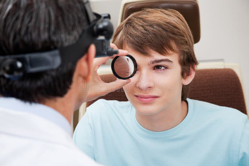 Optometrist Performing Dilated Retinal Exam Stock Photo - Image of ...