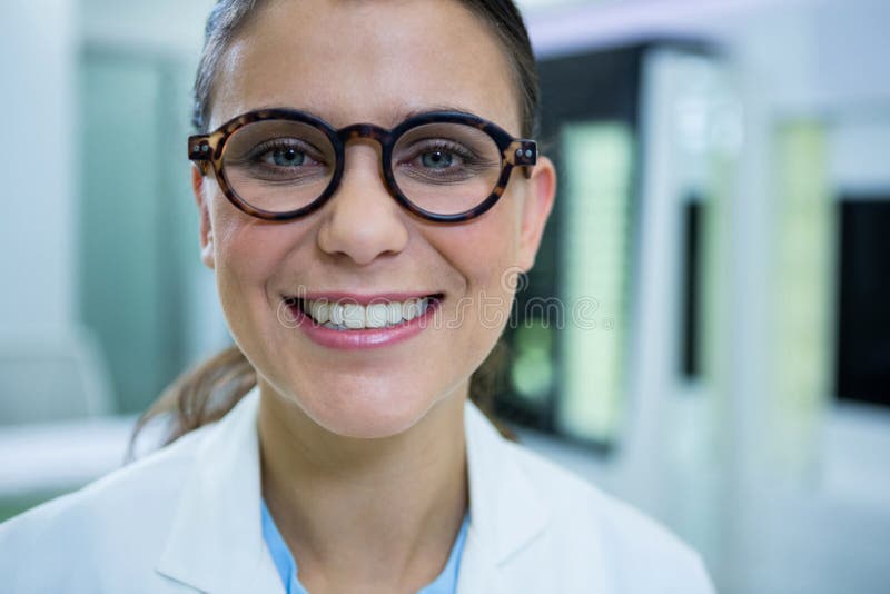 Optometrist in Spectacles Smiling in Optical Store Stock Photo - Image ...