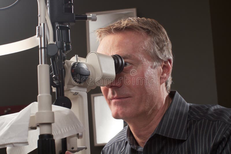 Optometrist Using Bio Microscope Stock Image - Image of vision, people ...