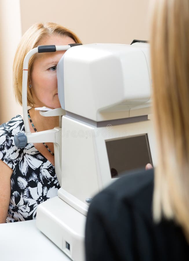 Optometrist Using Tonometer To Measure Patients Stock Photo - Image of ...