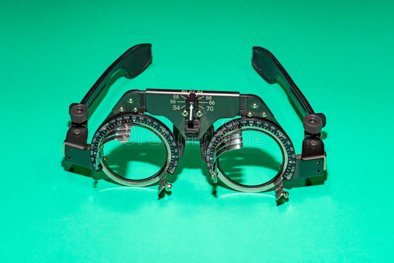 Optometry Optics Test Glasses on a Green Table. Stock Photo - Image of ...