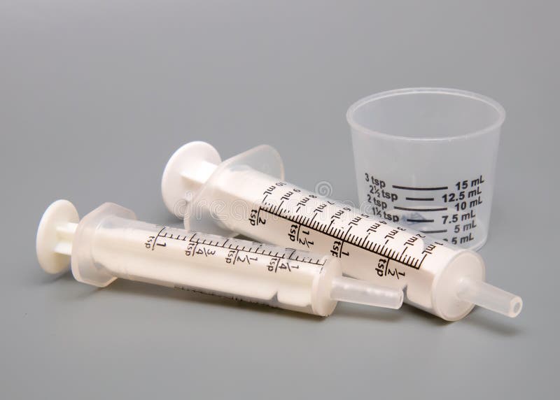 Oral Medicine Syringes And Cup Stock Image - Image of medical, lines ...