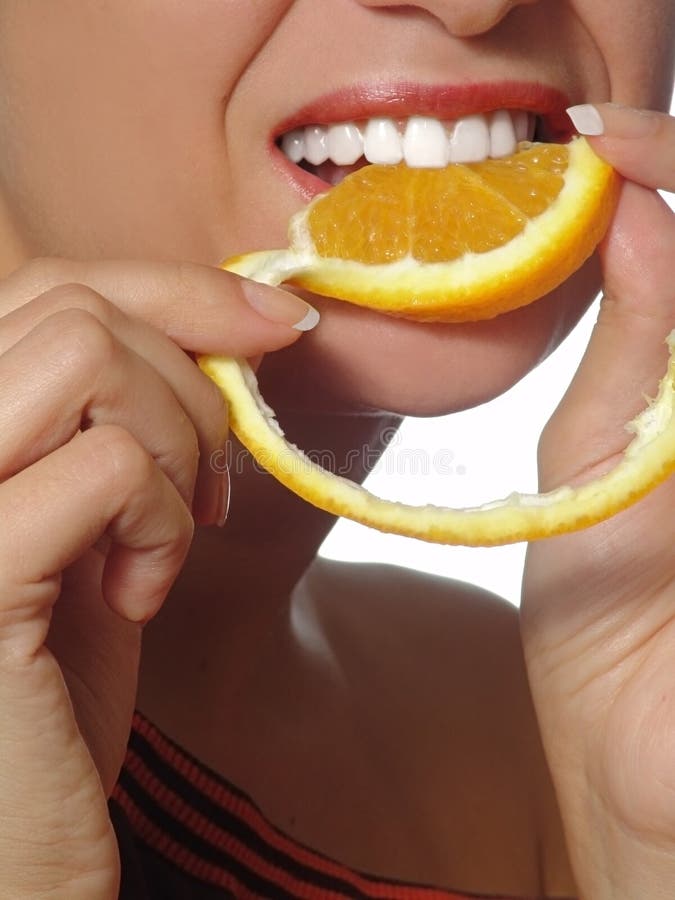 Orange stock photo. Image of closeup, juicy, hands, teeth - 1326338