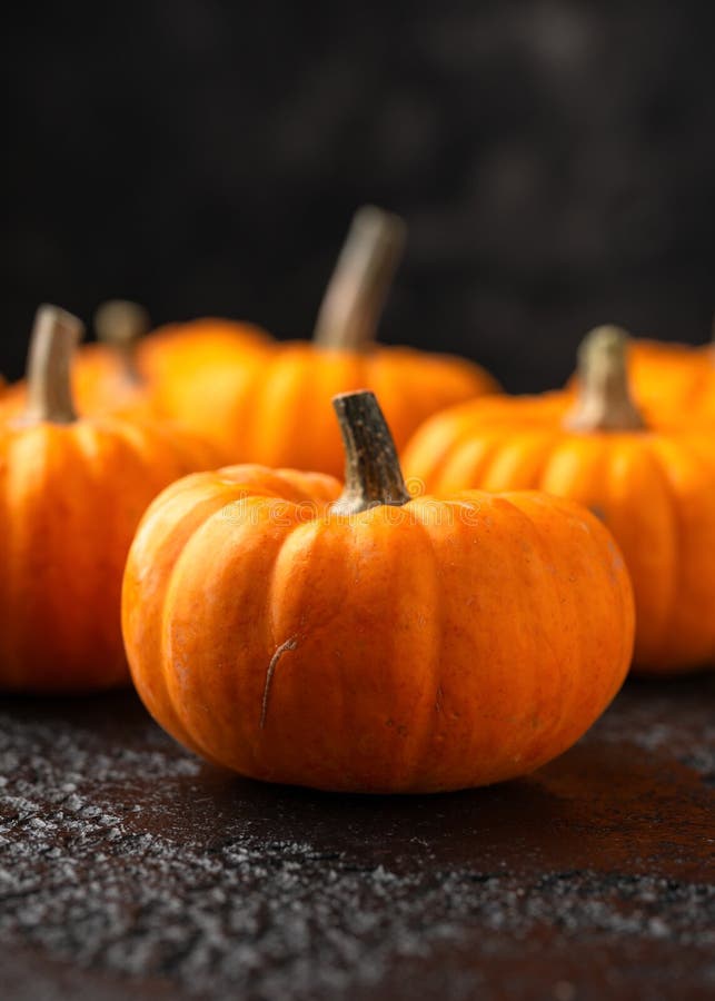 Orange Autumn Pumpkins on Rustic Dark Table Stock Image - Image of ...