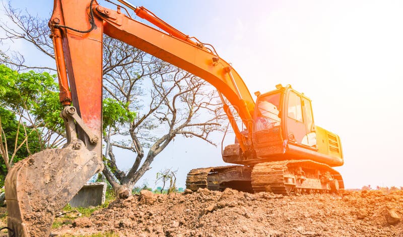 The Orange Backhoe Is On The Ground. Stock Photo - Image of bulldozer ...