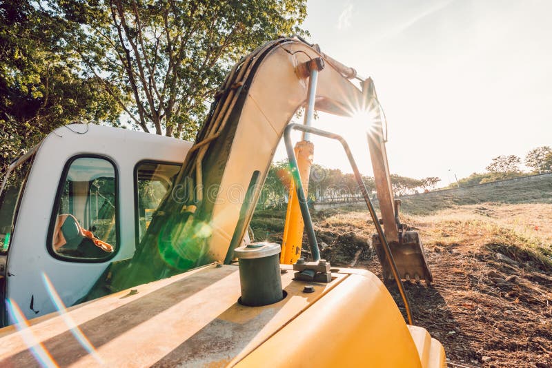 Orange Backhoe is on the Ground with Sunset Stock Image - Image of ...