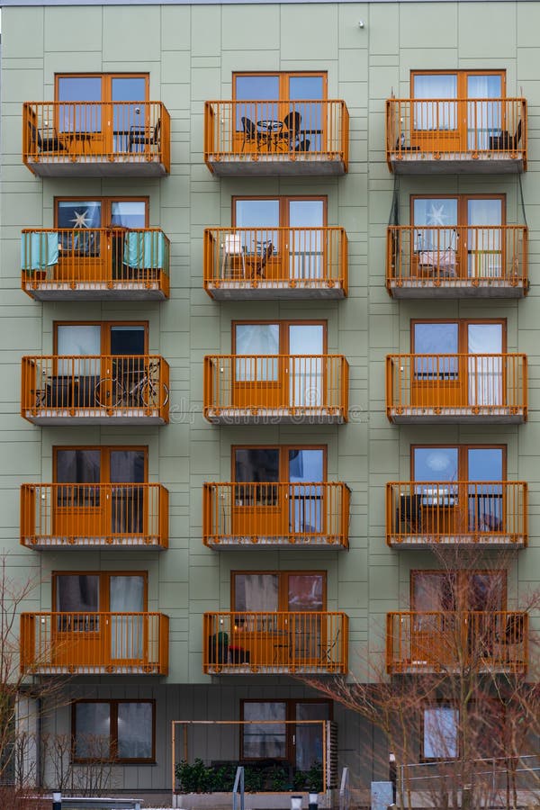Orange Balconies on a Green Apartment Building.. Stock Image - Image of ...