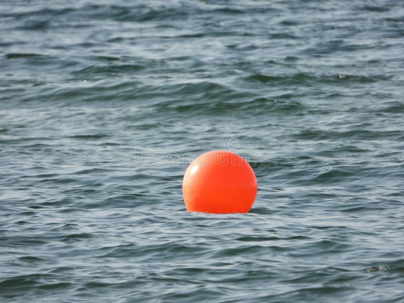 Orange Ball Floating on the Water S Surface Stock Image - Image of ...