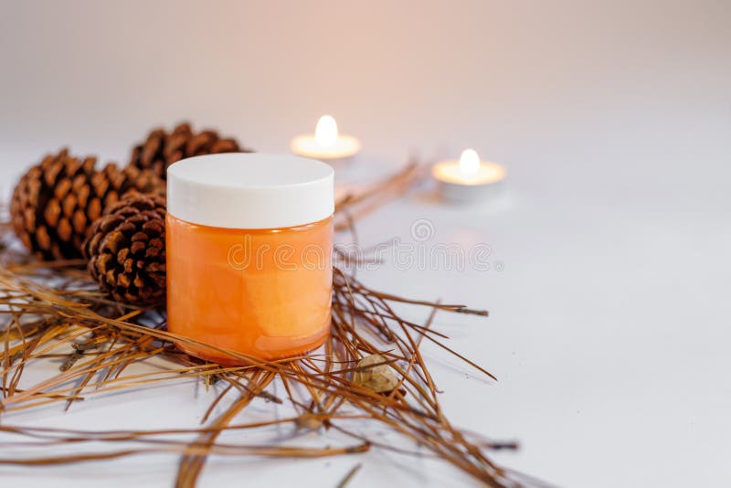 Orange Balm on Pine Leaves Pine Cones and Candles Stock Image - Image ...