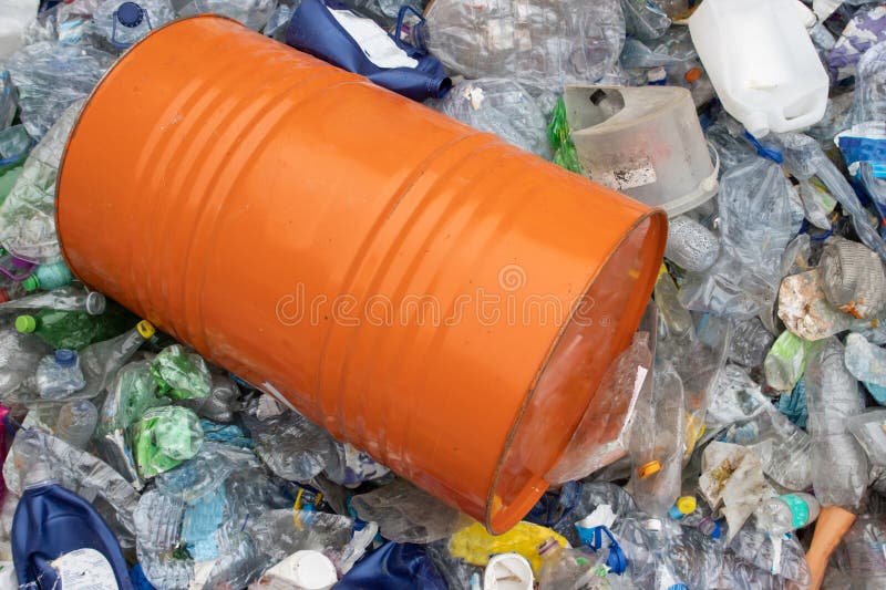 Orange Barrel in a Plastic Garbage Dump Stock Photo - Image of material ...