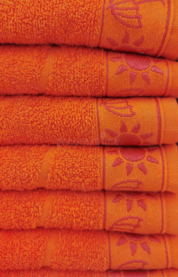 Orange Bath Towels Folded and Stacked on a Shelf Stock Image - Image of ...