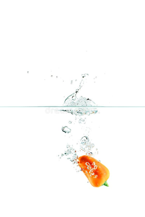 Orange Bell Pepper Falling into Water Splash on a White Background ...