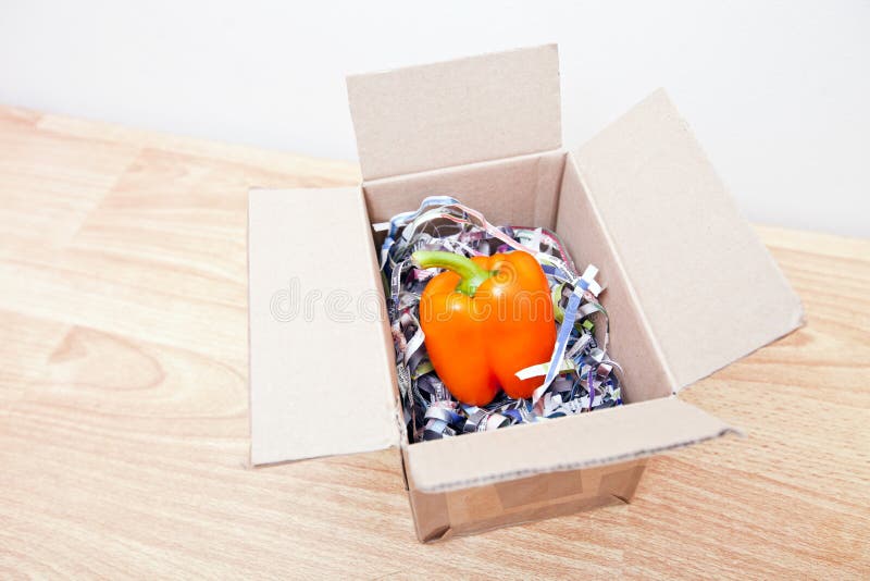 Orange Bell Pepper Wrapped Up in a Box Stock Photo - Image of ...