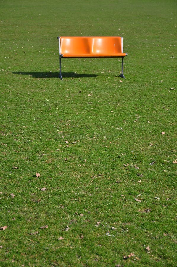 Orange bench on lawn stock image. Image of design, object - 24895507