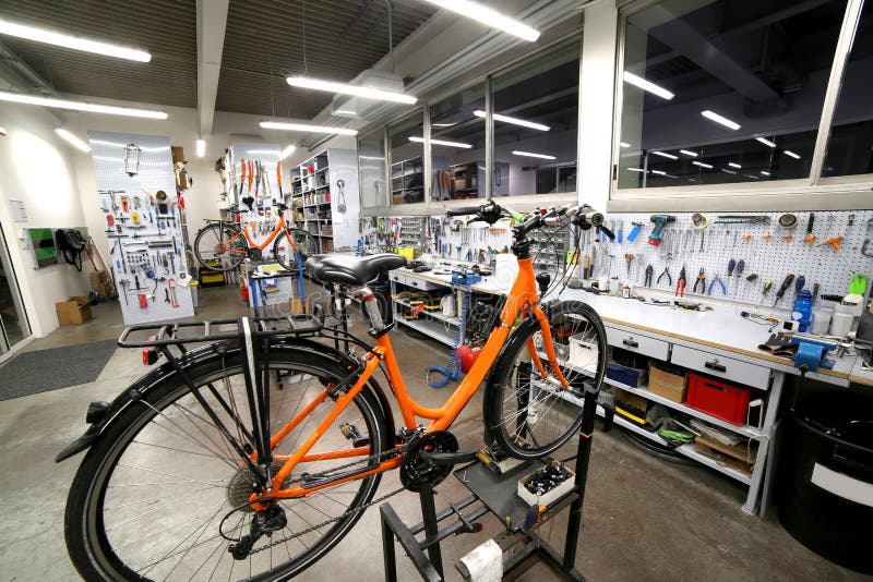 Orange Bicycle Broken in the Mechanical Workshop for Repair Stock Photo ...