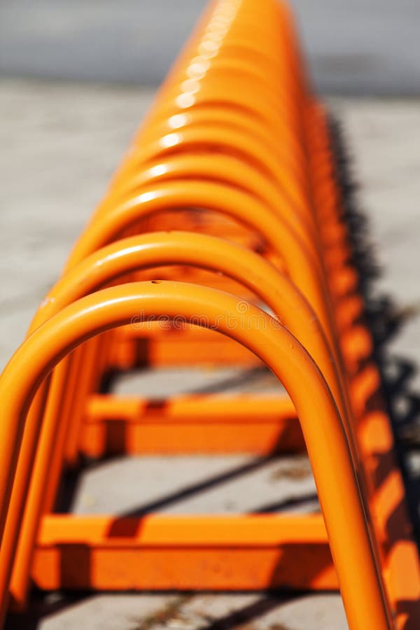 Orange Bicycle Racks in a Row by the River Stock Image - Image of ...