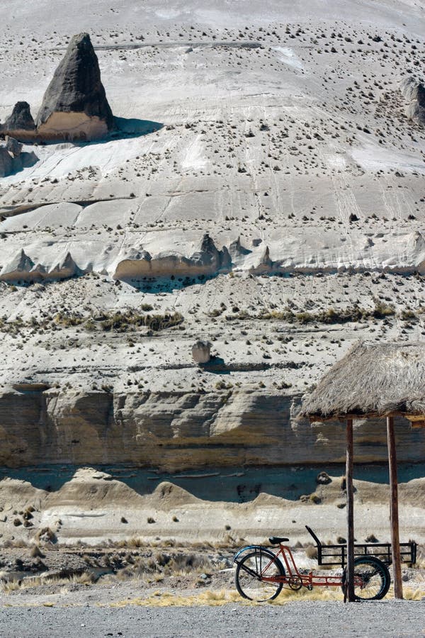 Orange Bicycle in a White Desert with Black Rocks Stock Photo - Image ...