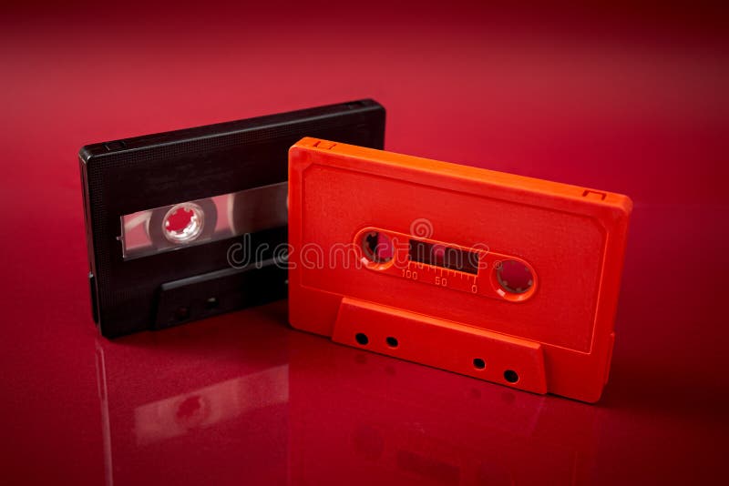 Orange and Black Audio Cassette on Dark Red Background Stock Image ...