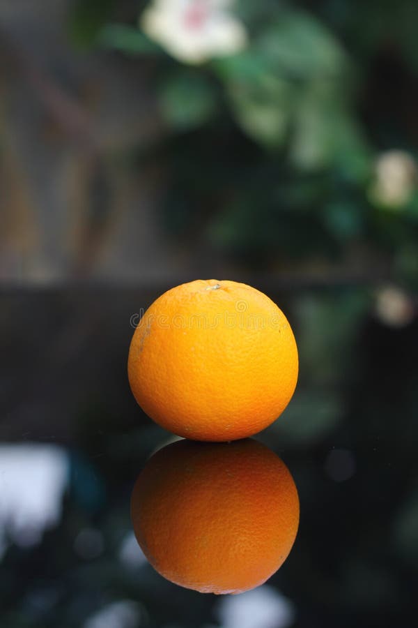 Orange on Black Background. with Reflection. Stock Image - Image of ...