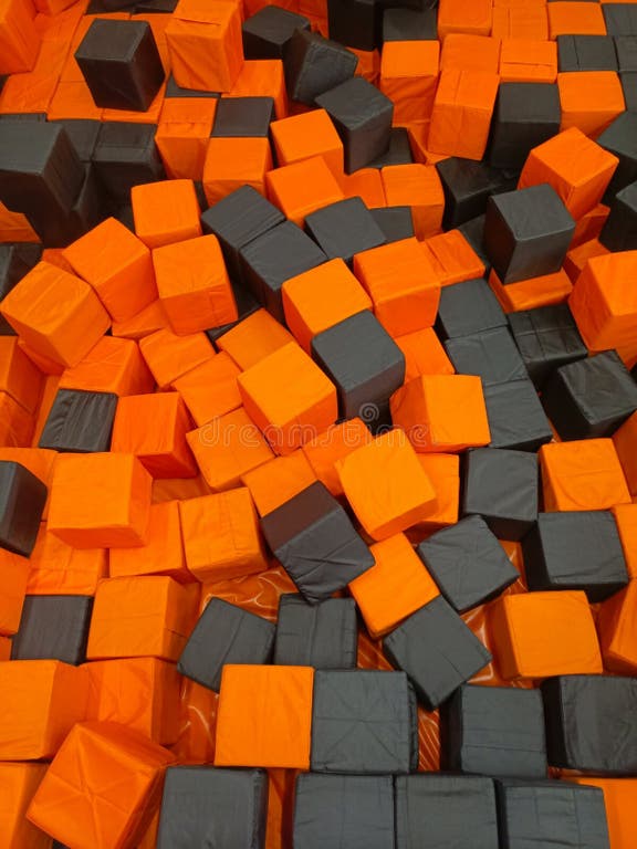 Orange and Black Soft Cubes in a Game Pit with a Textured Background ...