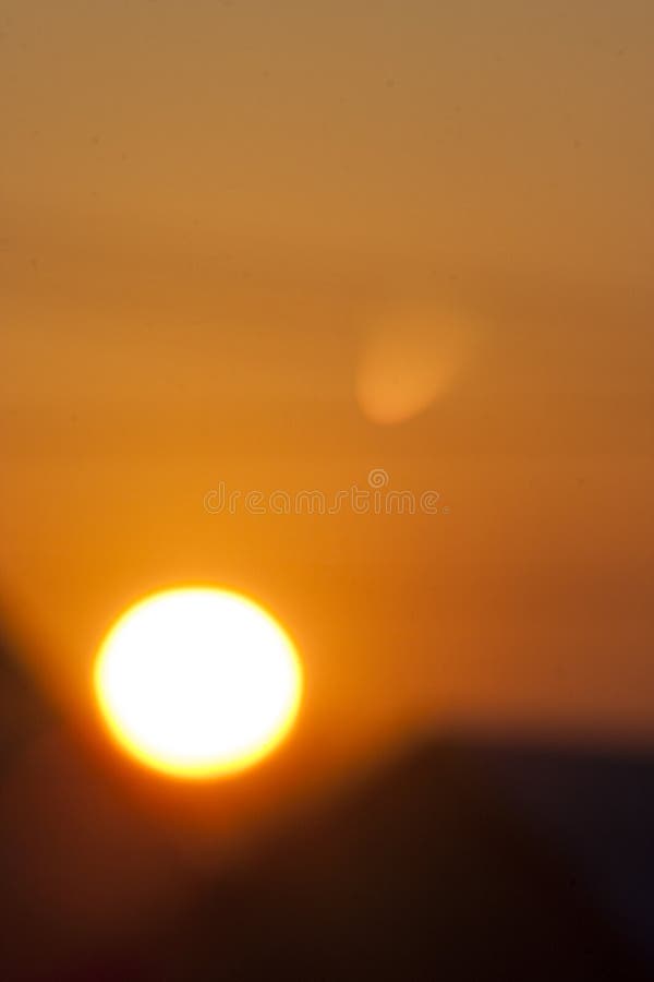 Orange Blurry Sunset Full of Sun Stock Photo - Image of horizon ...