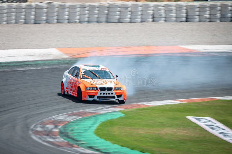 Orange BMW E46 Producing Smoke on a Trail for a Drift Competition ...