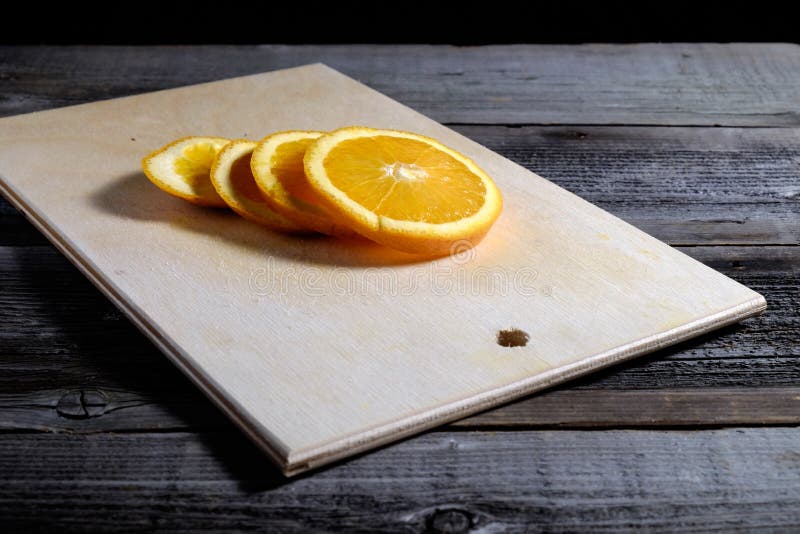 Orange on the board stock photo. Image of white, food - 64919896