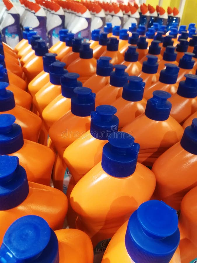 Orange Bottles with Detergent in the Shop Stock Photo - Image of group ...