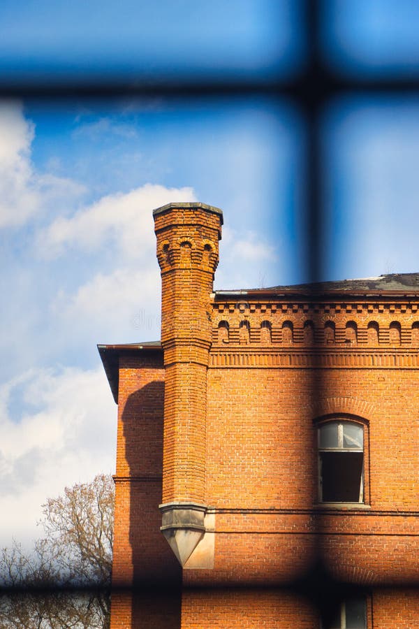 Orange Brick Building Shot Taken from Behind the Bars Stock Photo ...