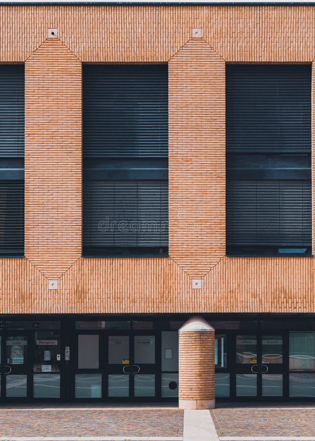 Orange Brick Building with Three Large Windows. Stock Photo - Image of ...