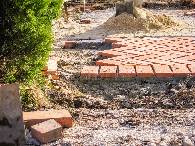Orange Brick Paving Stones in Construction Process Stock Image - Image ...