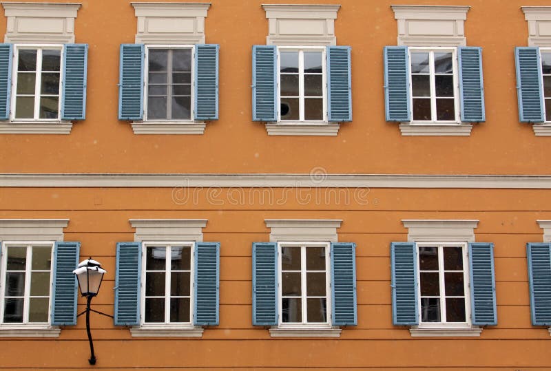 Orange Building with Blue Opened Windows Stock Photo - Image of england ...
