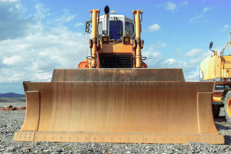 Big orange bulldozer stock photo. Image of building - 111989348