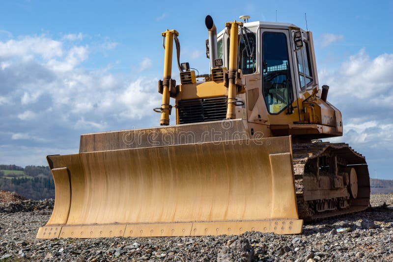 Orange Bulldozer Loads Wet Snow To Trucks for Snow Melting Stock Photo ...