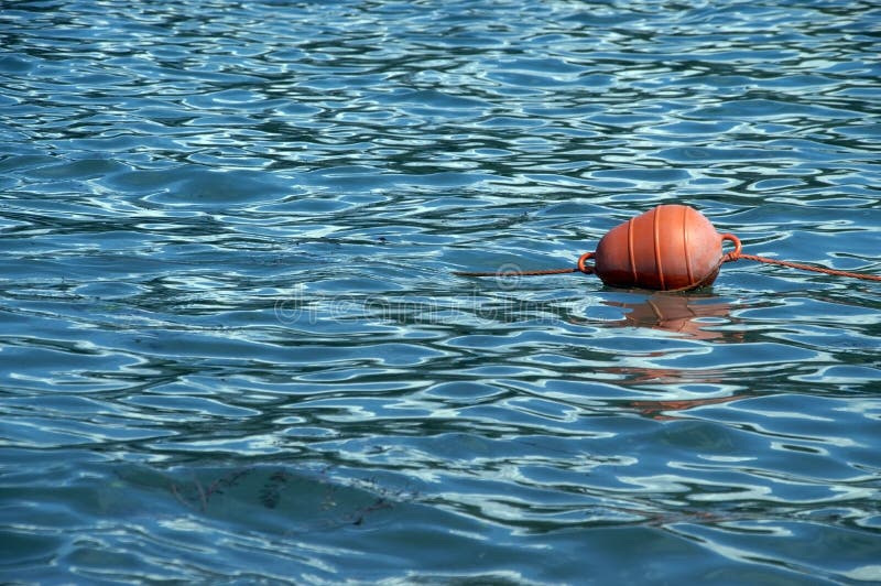 Orange Buoy Floating on Sea Stock Photo - Image of rippled, device: 1382472