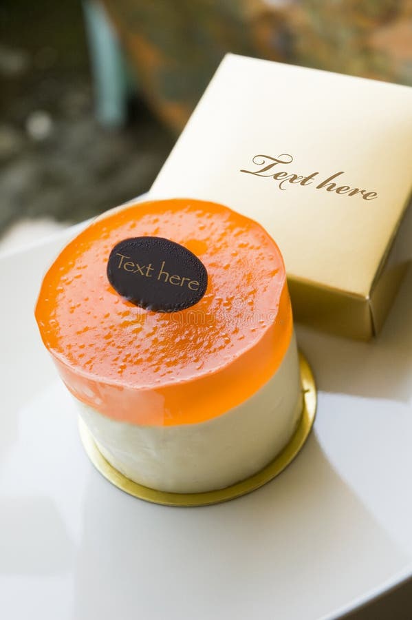 Orange cake and golden box stock image. Image of empty - 20191069