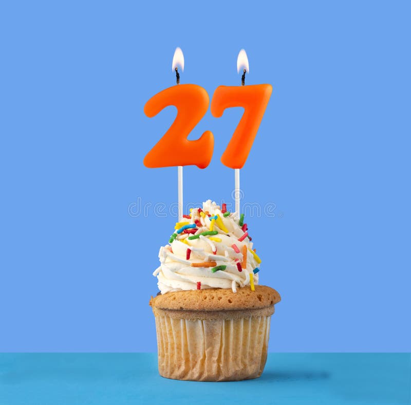 Orange Candle Number 27 - Birthday Cupcake on Blue Background Stock ...