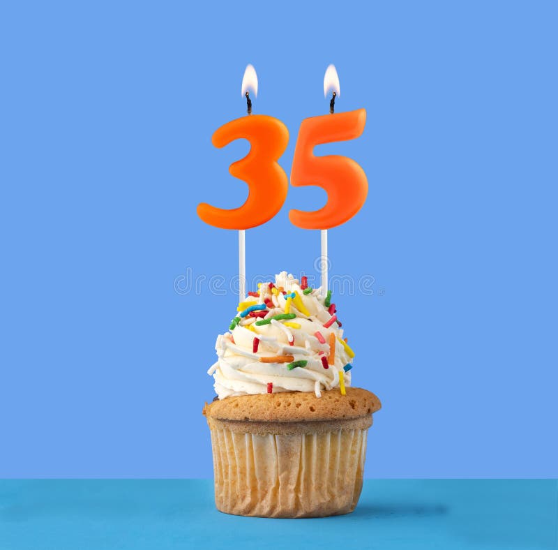 Orange Candle Number 35 - Birthday Cupcake on Blue Background Stock ...