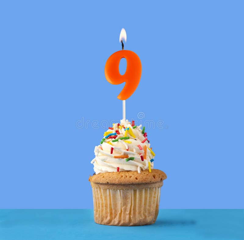 Orange Candle Number 9 - Birthday Cupcake on Blue Background Stock ...