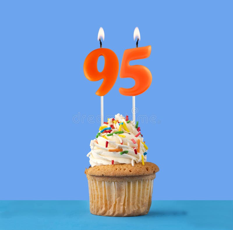 Orange Candle Number 95 - Birthday Cupcake on Blue Background Stock ...