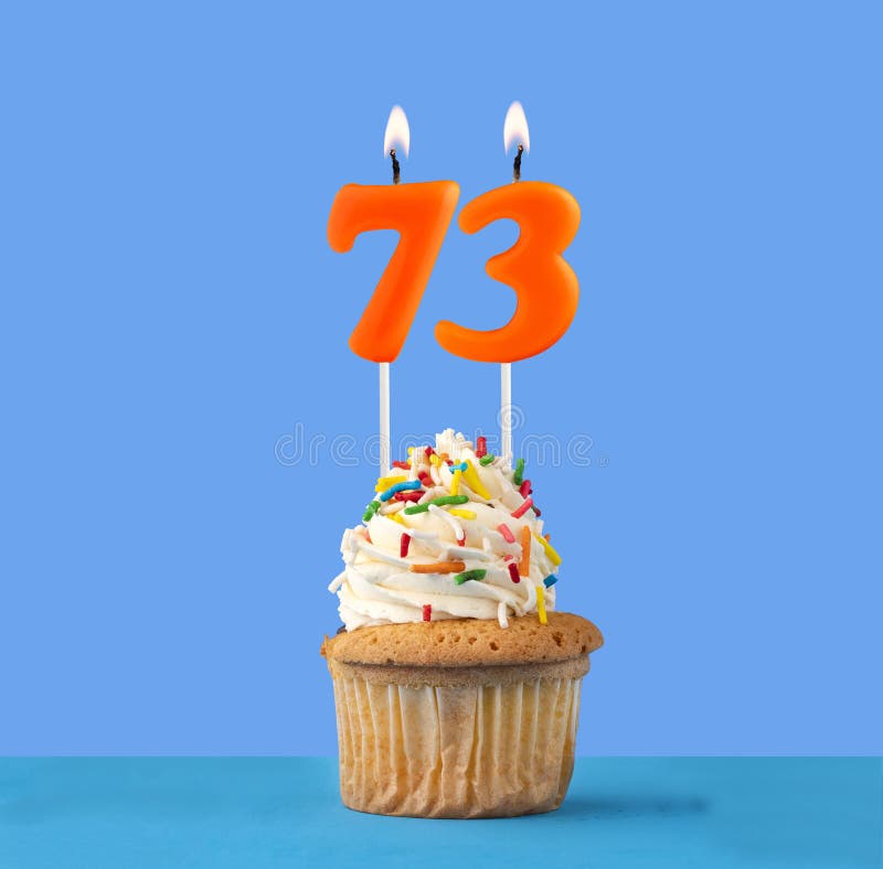 Orange Candle Number 73 - Birthday Cupcake on Blue Background Stock ...