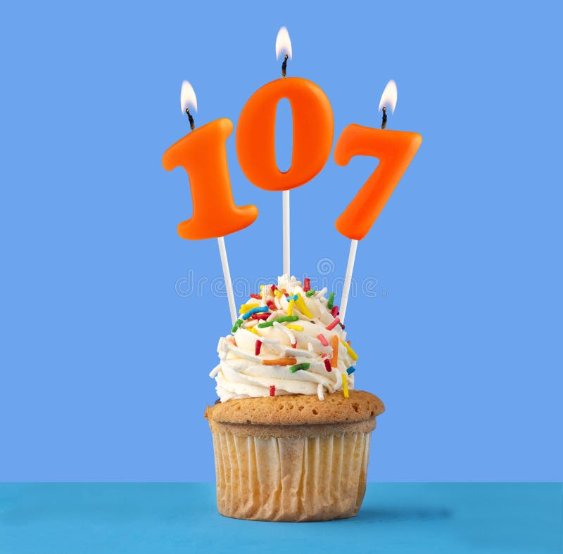 Orange Candle Number 107 - Birthday Cupcake on Blue Background Stock ...