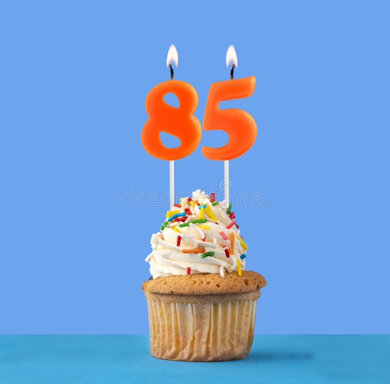 Orange Candle Number 85 - Birthday Cupcake on Blue Background Stock ...