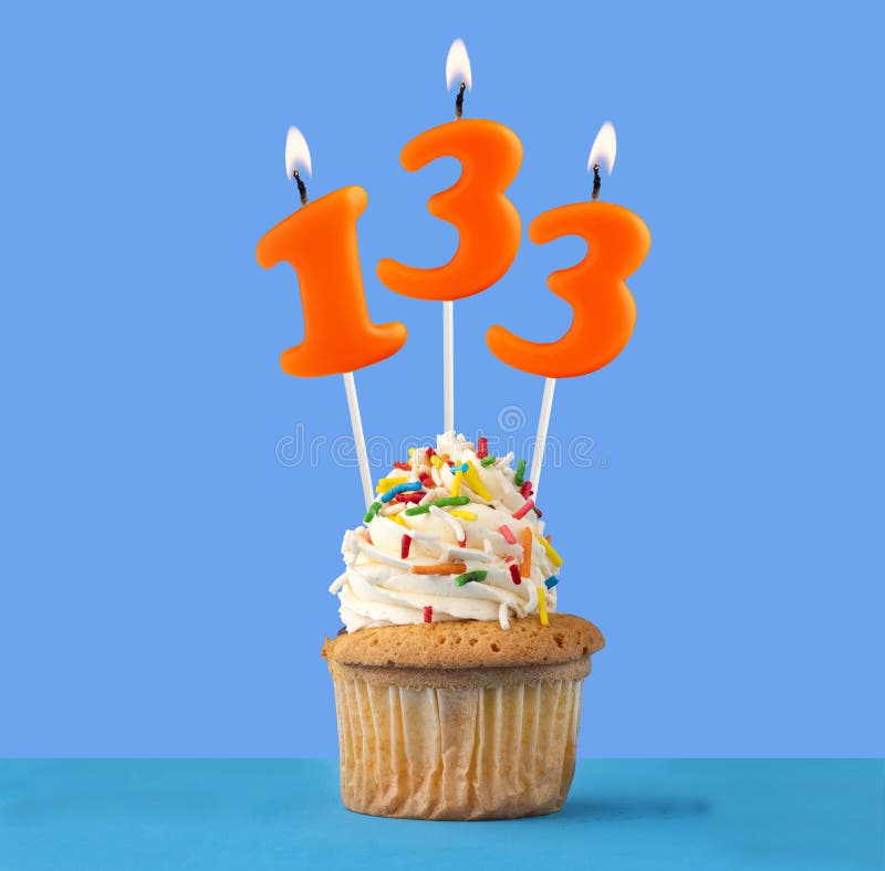 Orange Candle Number 133 - Birthday Cupcake on Blue Background Stock ...