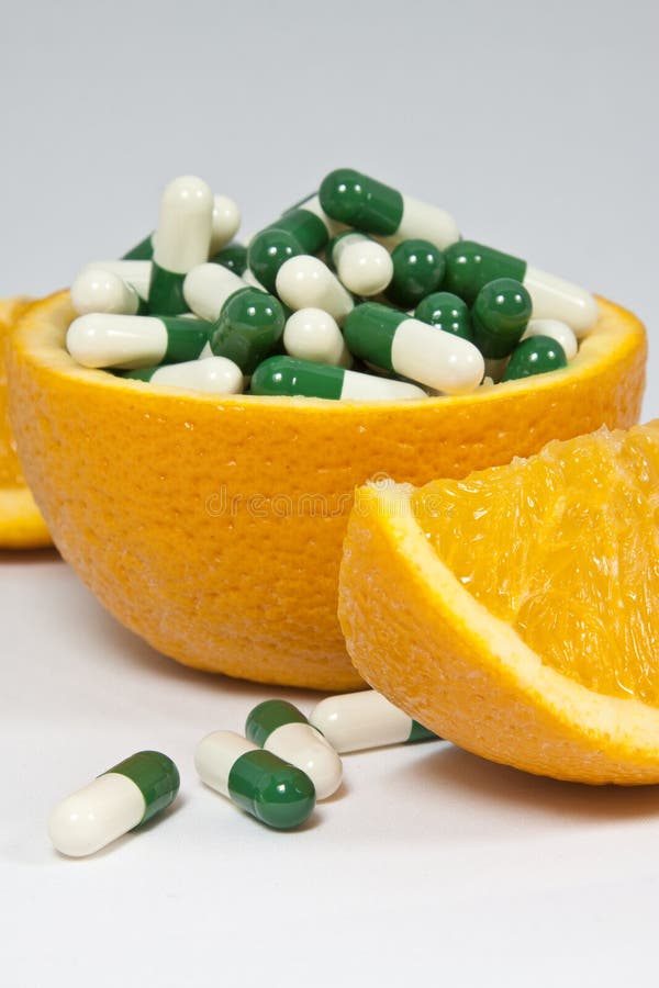 Orange and capsule stock image. Image of orange, glass - 14809435