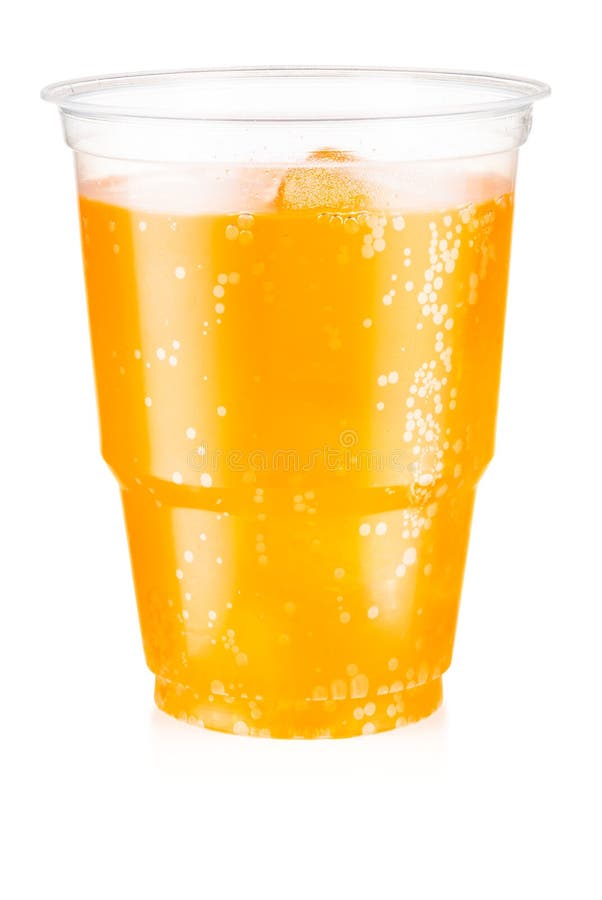Orange Carbonated Drink in a Glass and Ice, Close-up on a White ...
